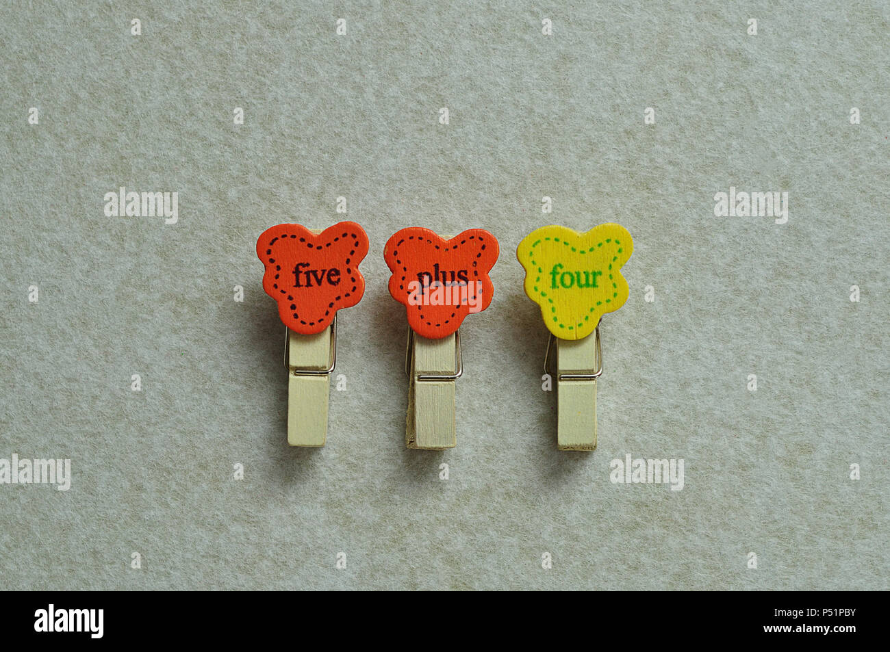 Five plus four on a white background Stock Photo - Alamy
