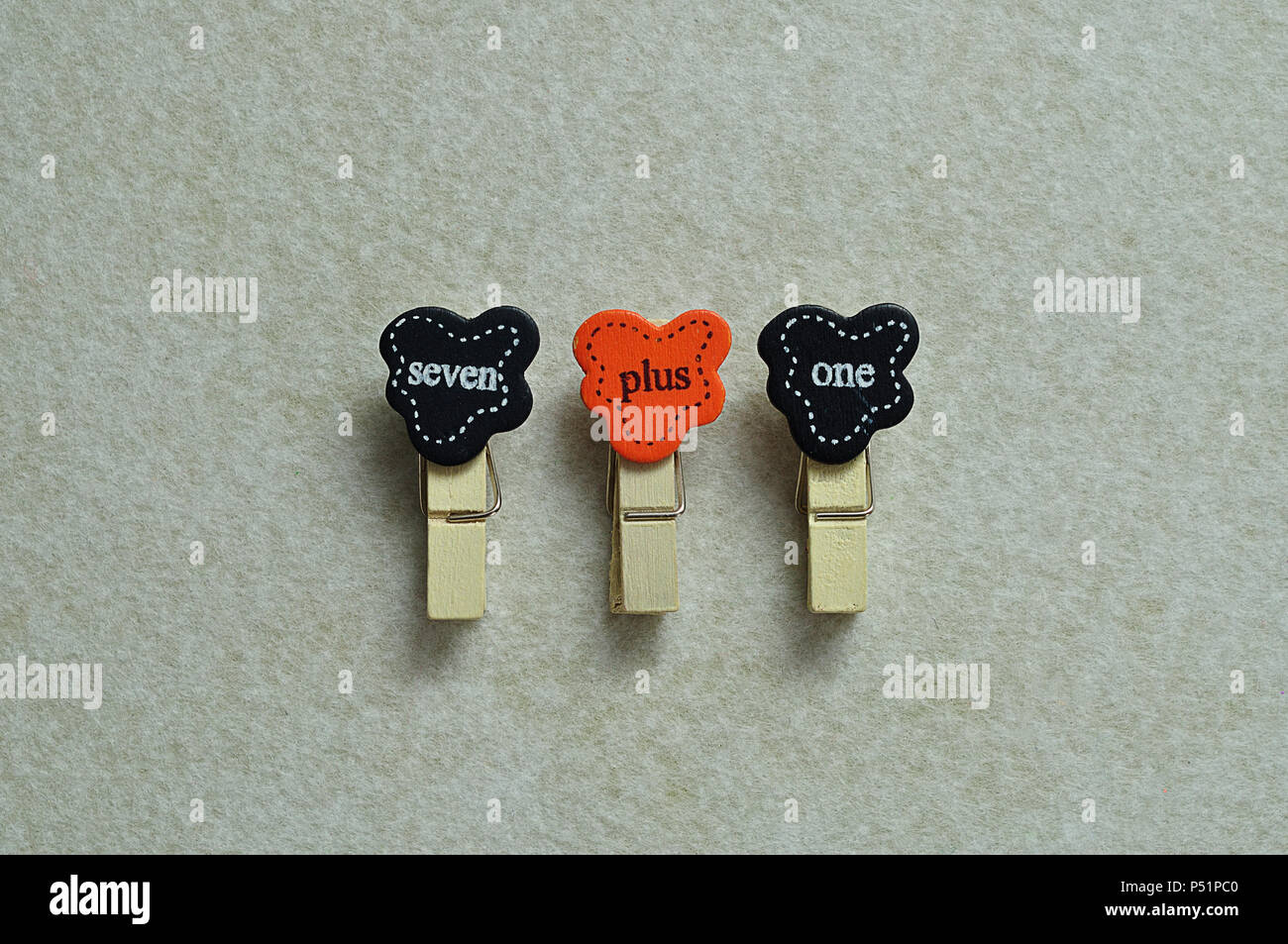 Seven plus one on a white background Stock Photo - Alamy