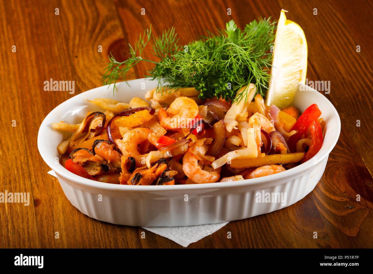 Seafood cocktail with squid, mussels and shrimps Stock Photo - Alamy