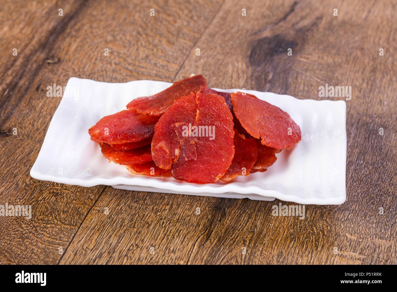 Dry pork meat heap over wooden Stock Photo - Alamy