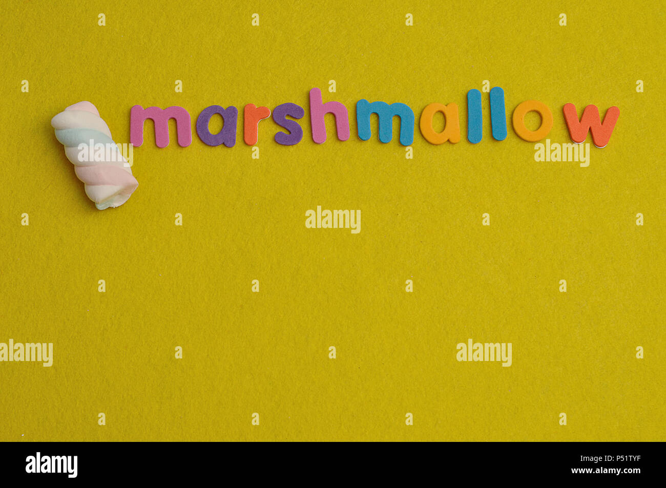 A pastel colored marshmallow displayed with the word marshmallow on a ...