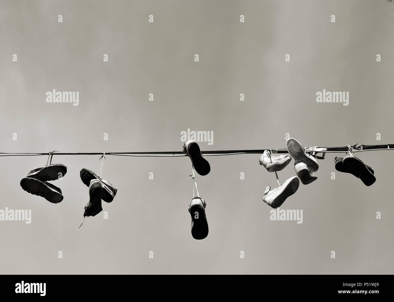 Shoes tied shoelaces hanging hi-res stock photography and images - Alamy