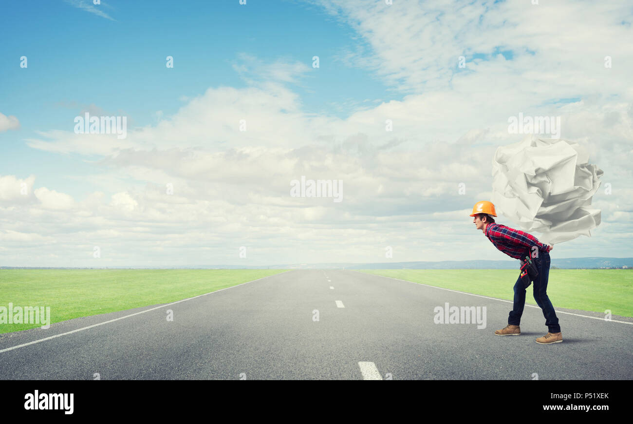 Engineer man carry load Stock Photo - Alamy