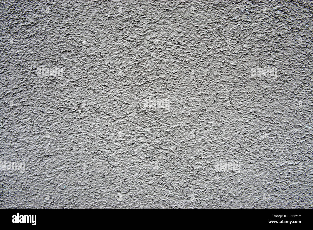 A stone wall covered in plaster macro Stock Photo - Alamy