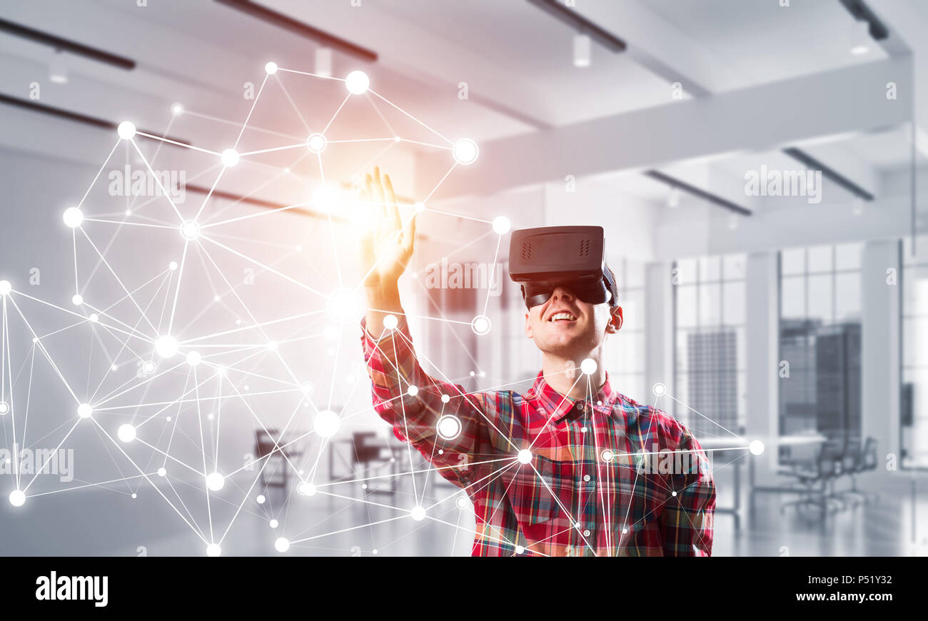 Guy wearing checked shirt and virtual mask reaching hand to touch ...