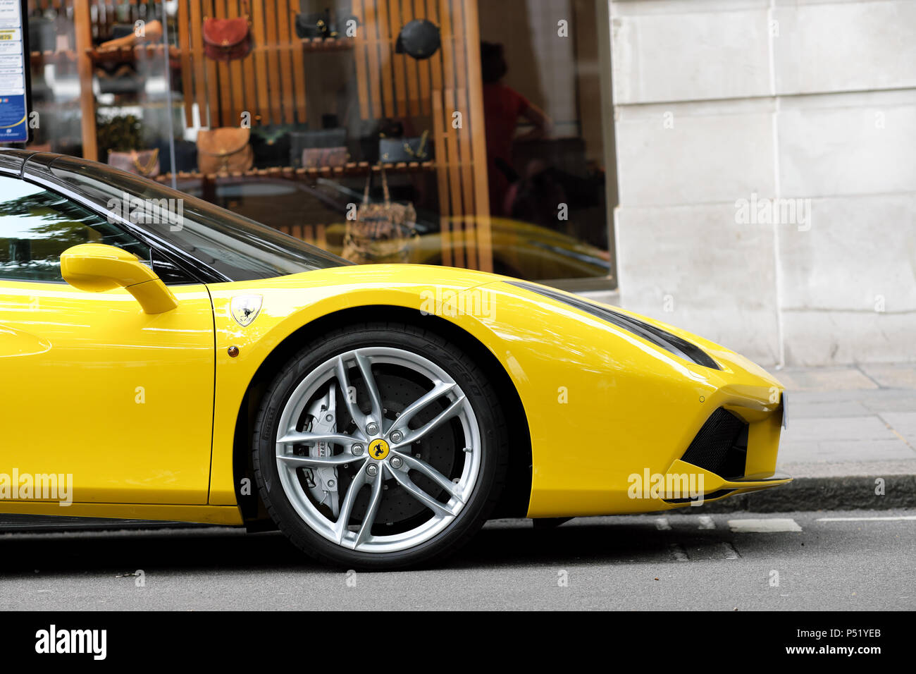 Ferrari yellow luxury sports car parked in Mayfair London June 2018 ...