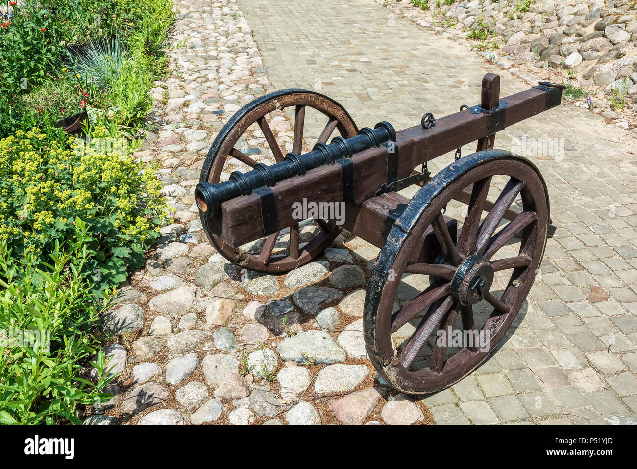 Old little cannon on an adjustable wheeled carriage Stock Photo - Alamy