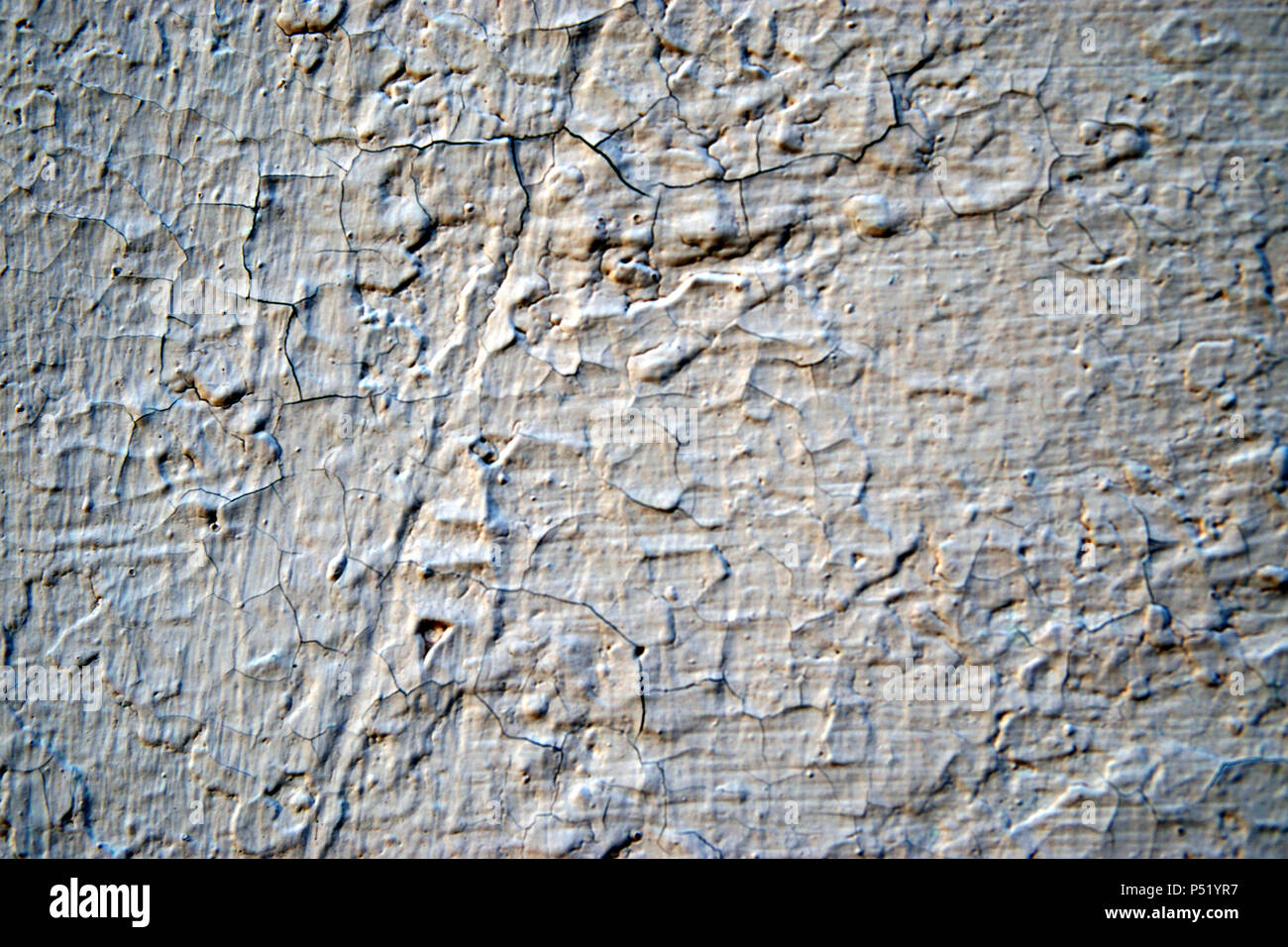 A stone wall covered in plaster macro Stock Photo - Alamy