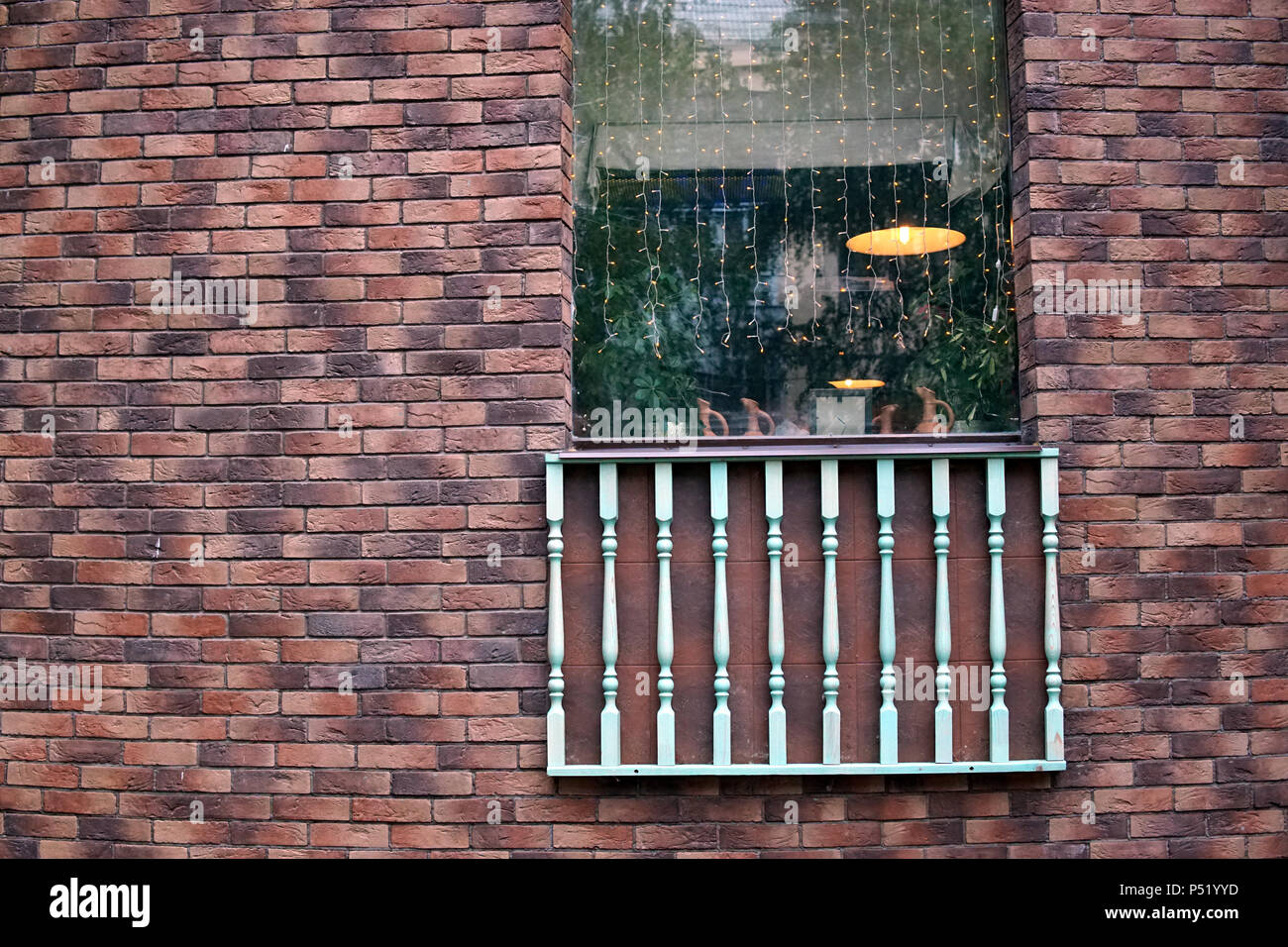 Brick wall of a cafe with a window in it Stock Photo - Alamy