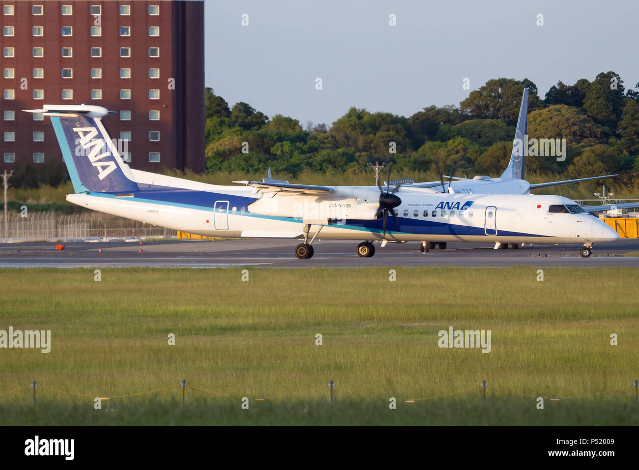 All Nippon Airways ANA Wings Bombardier Dash 8-400 lining up at Tokyo ...