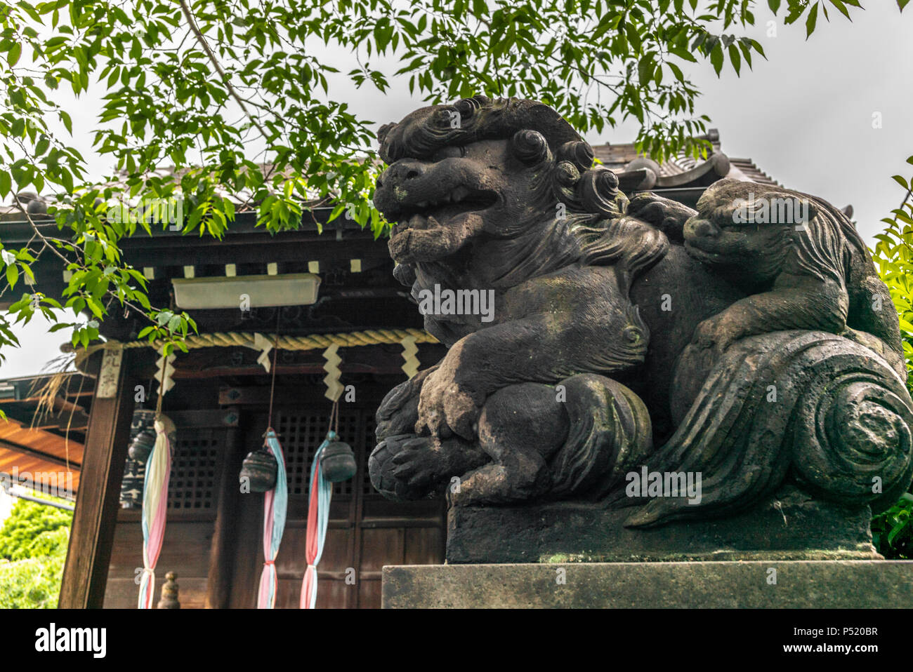 A stone dragon in a Shintoist shrine in Tokyo - 1 Stock Photo - Alamy