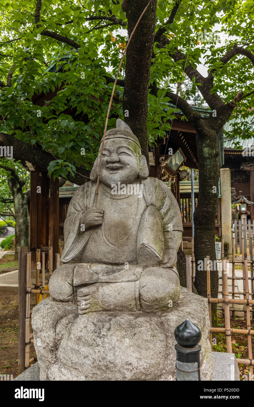 Stone statue in a Shintoist shrine in Tokyo - 3 Stock Photo - Alamy