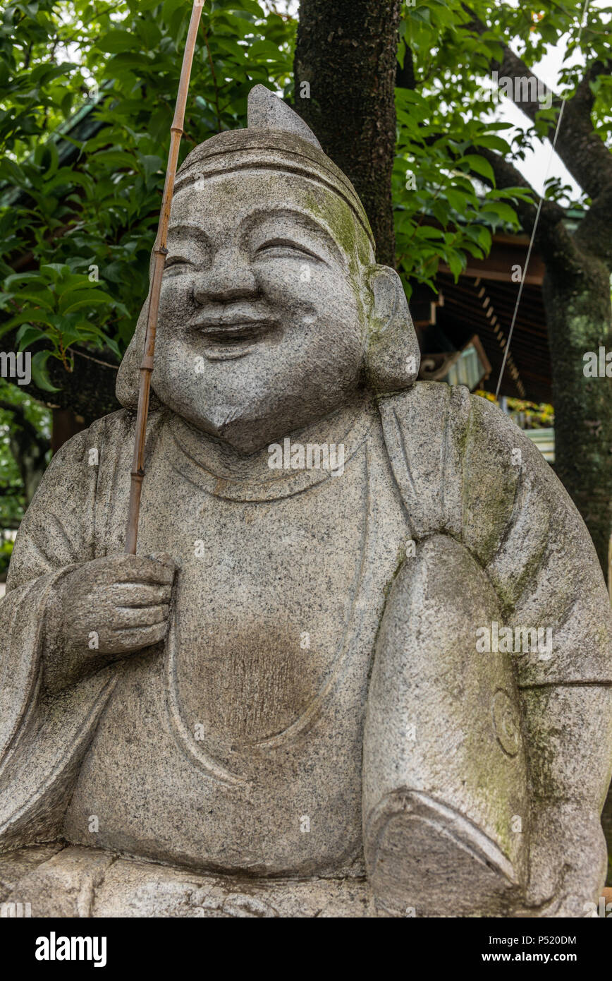 Stone statue in a Shintoist shrine in Tokyo - 4 Stock Photo - Alamy