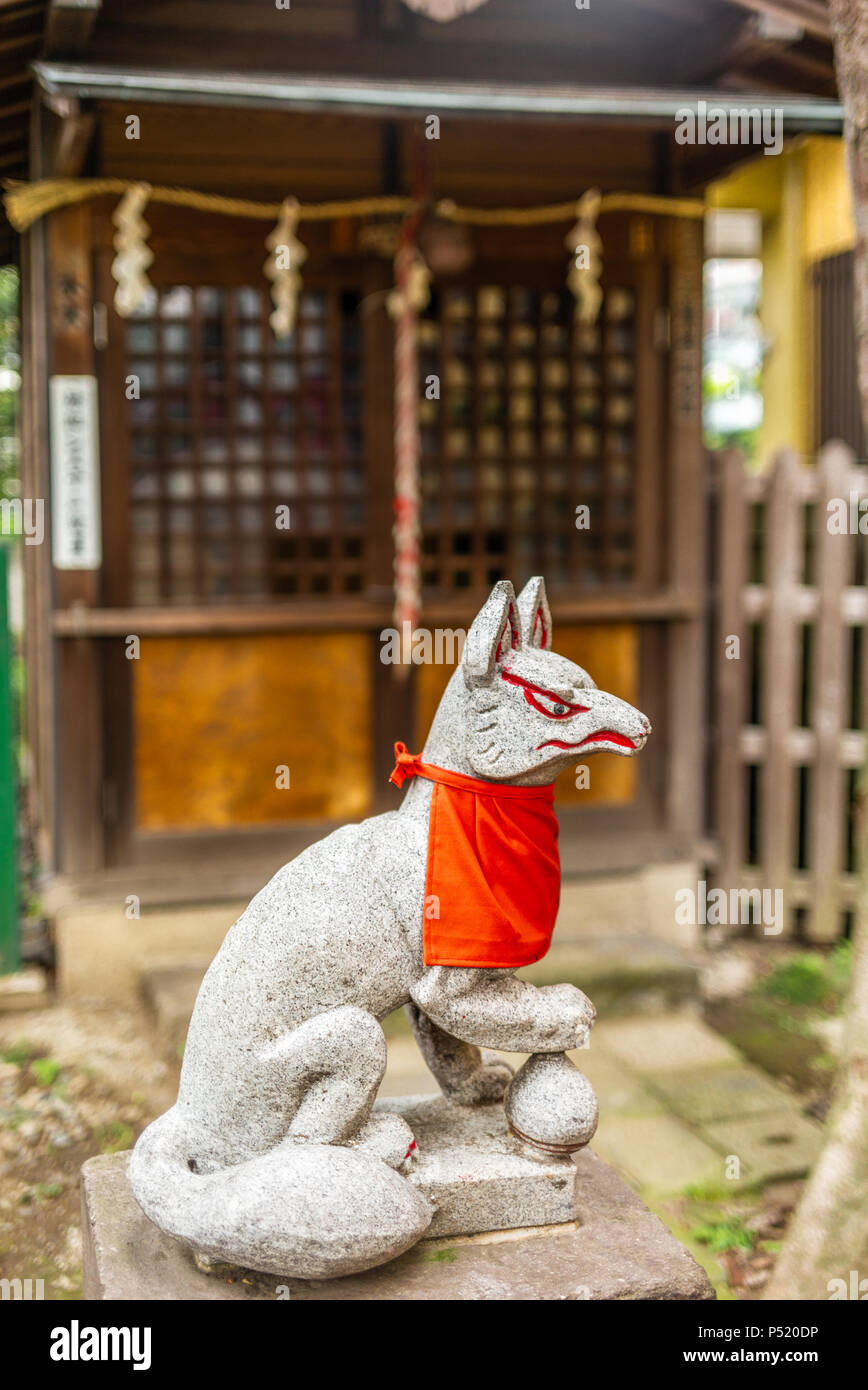 A stone fox in a Shintoist shrine in Tokyo Stock Photo - Alamy