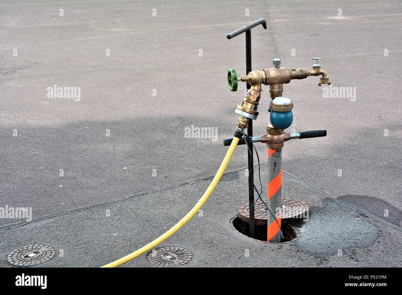 Water supply through a hydrant Stock Photo - Alamy