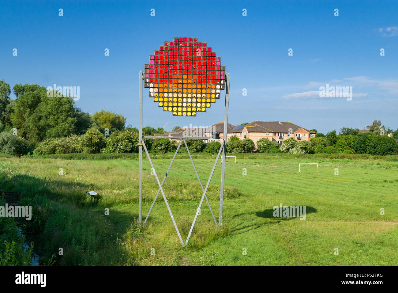 A large colourful steel tower with nesting boxes for Swifts stands in ...
