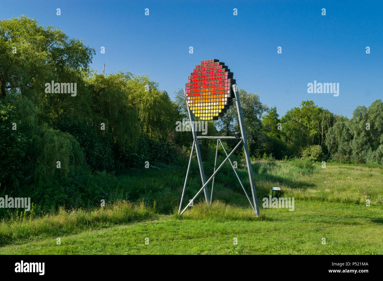 A large colourful steel tower with nesting boxes for Swifts stands in ...