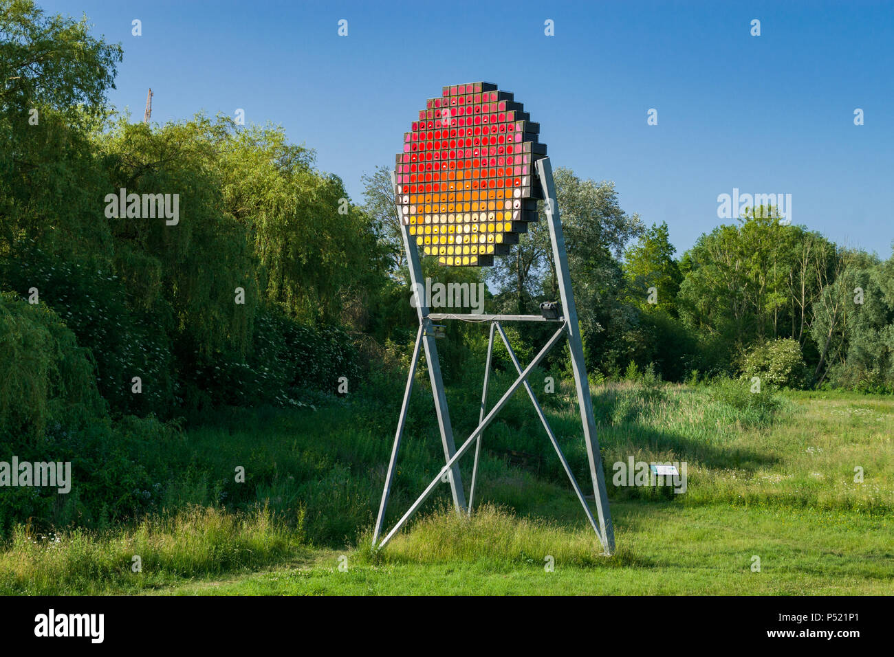 A large colourful steel tower with nesting boxes for Swifts stands in ...