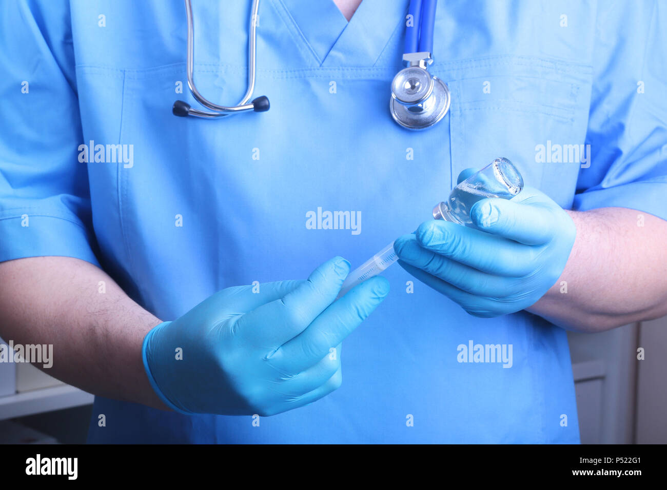 Medical injection in hand. Doctor holding medical injection syringe ...