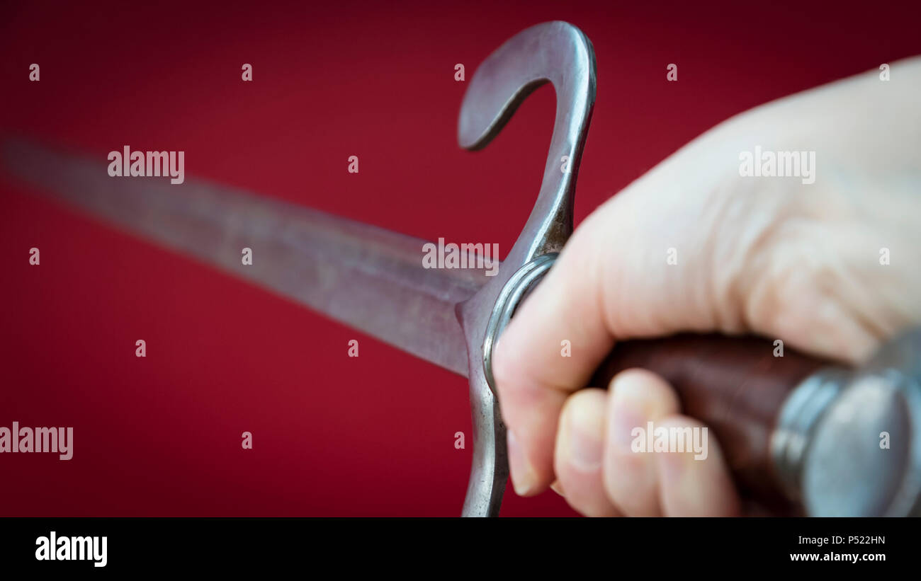Hand holding sword hilt hi-res stock photography and images - Alamy