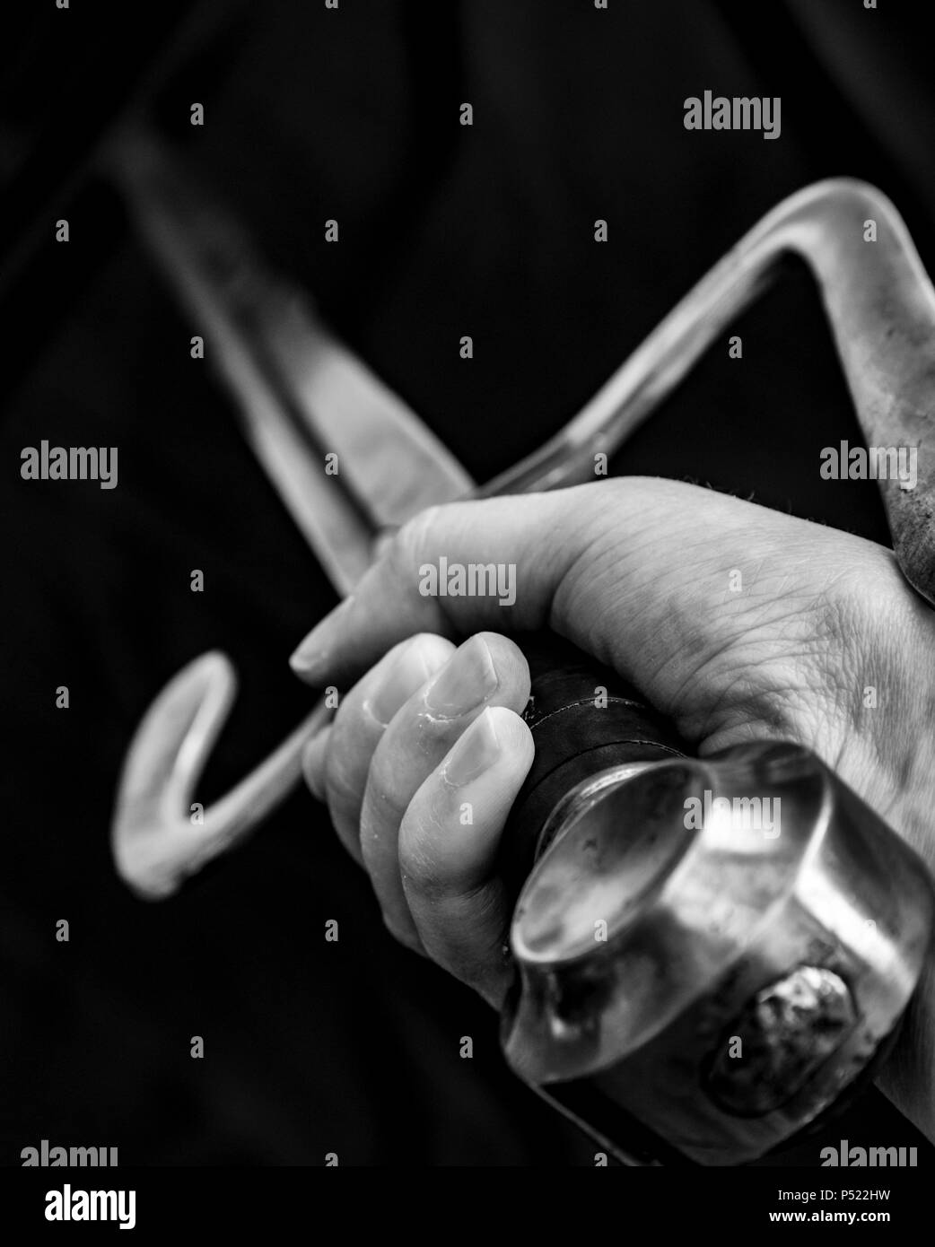 Hand holding sword hilt hi-res stock photography and images - Alamy