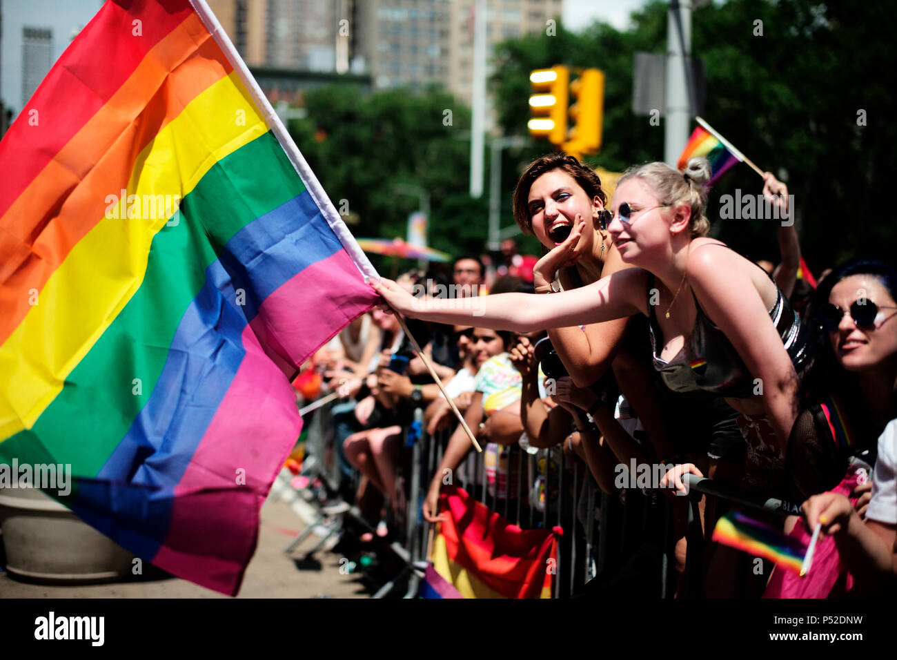 New York, USA. 24th June, 2018. Spectators watch the 2018 New York City ...