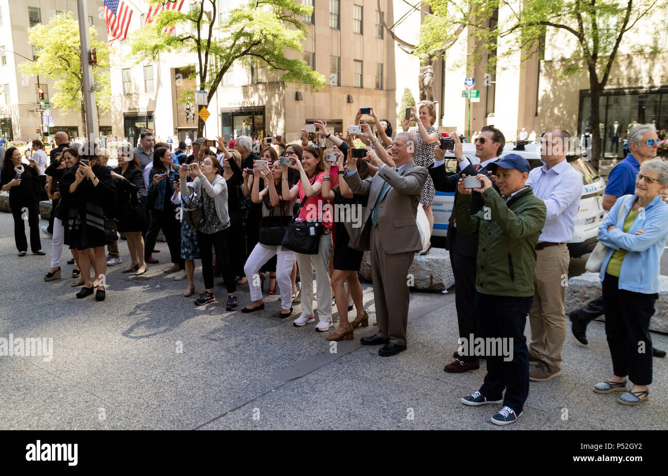 5th Avenue New York USA, Group of people using mobile phones & cameras ...