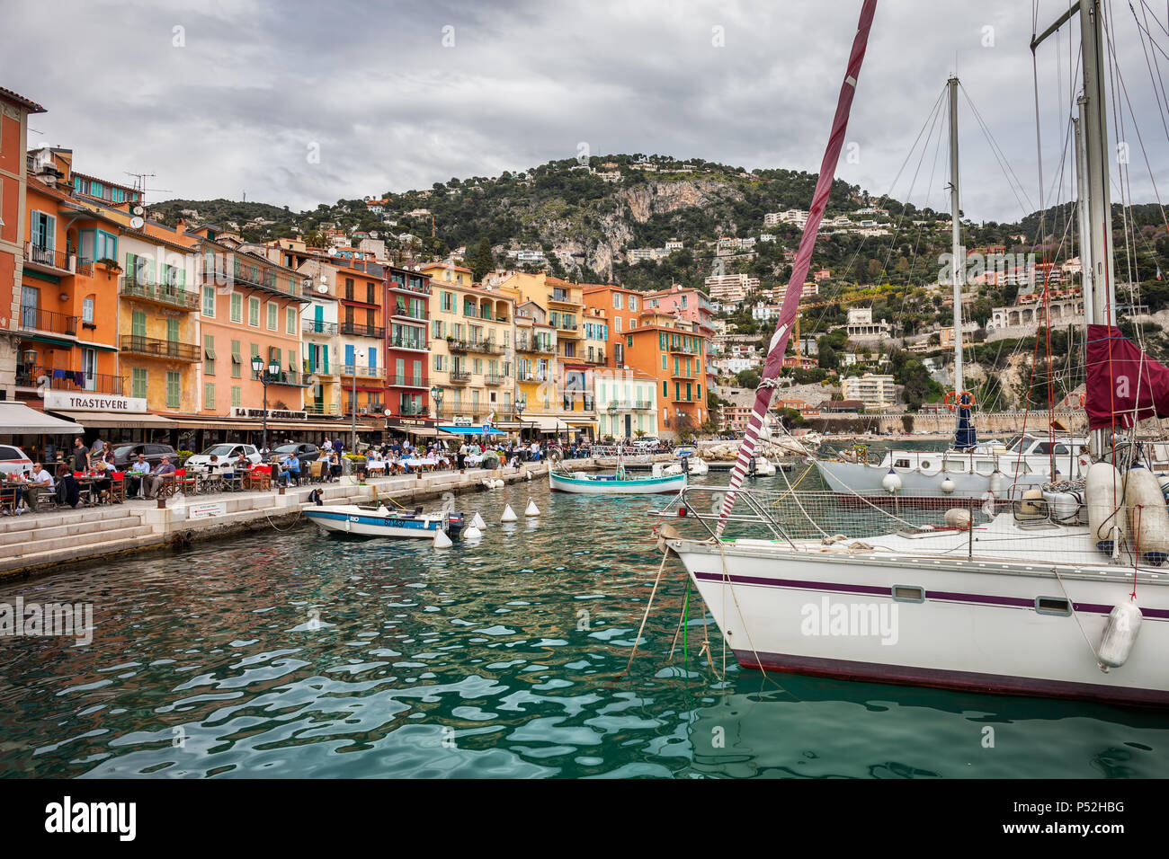 Colorful houses and sailboats in Villefranche sur Mer resort town at ...