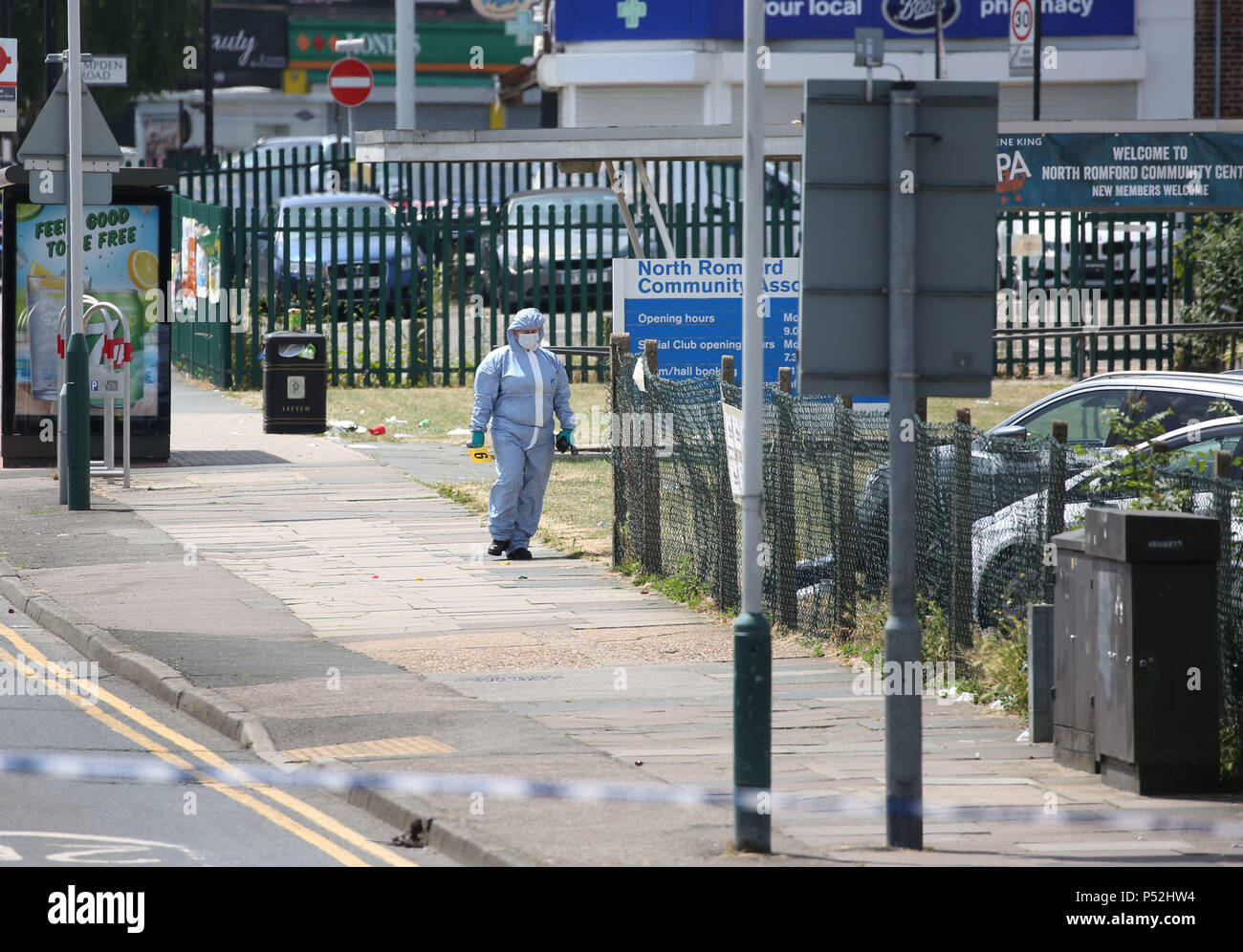 Forensic investigators at the scene of a stabbing in Romford, east ...