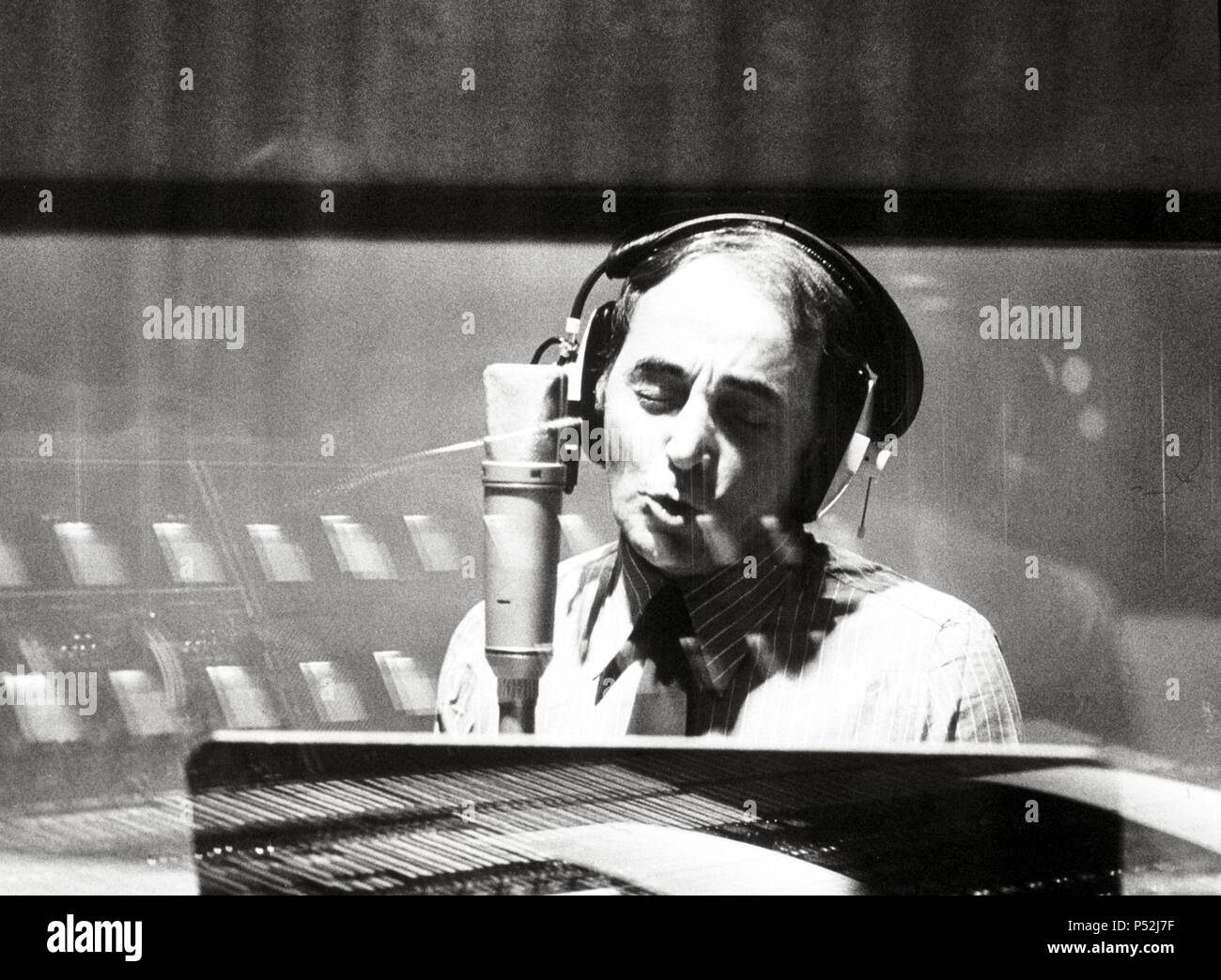 French singer Charles Aznavour perfoming in a recording studio ...