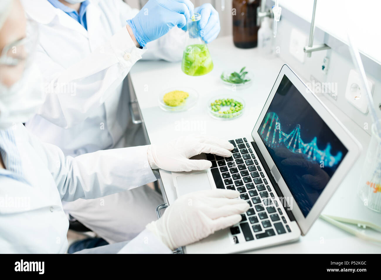 Scientists surveying computer model of food DNA Stock Photo - Alamy
