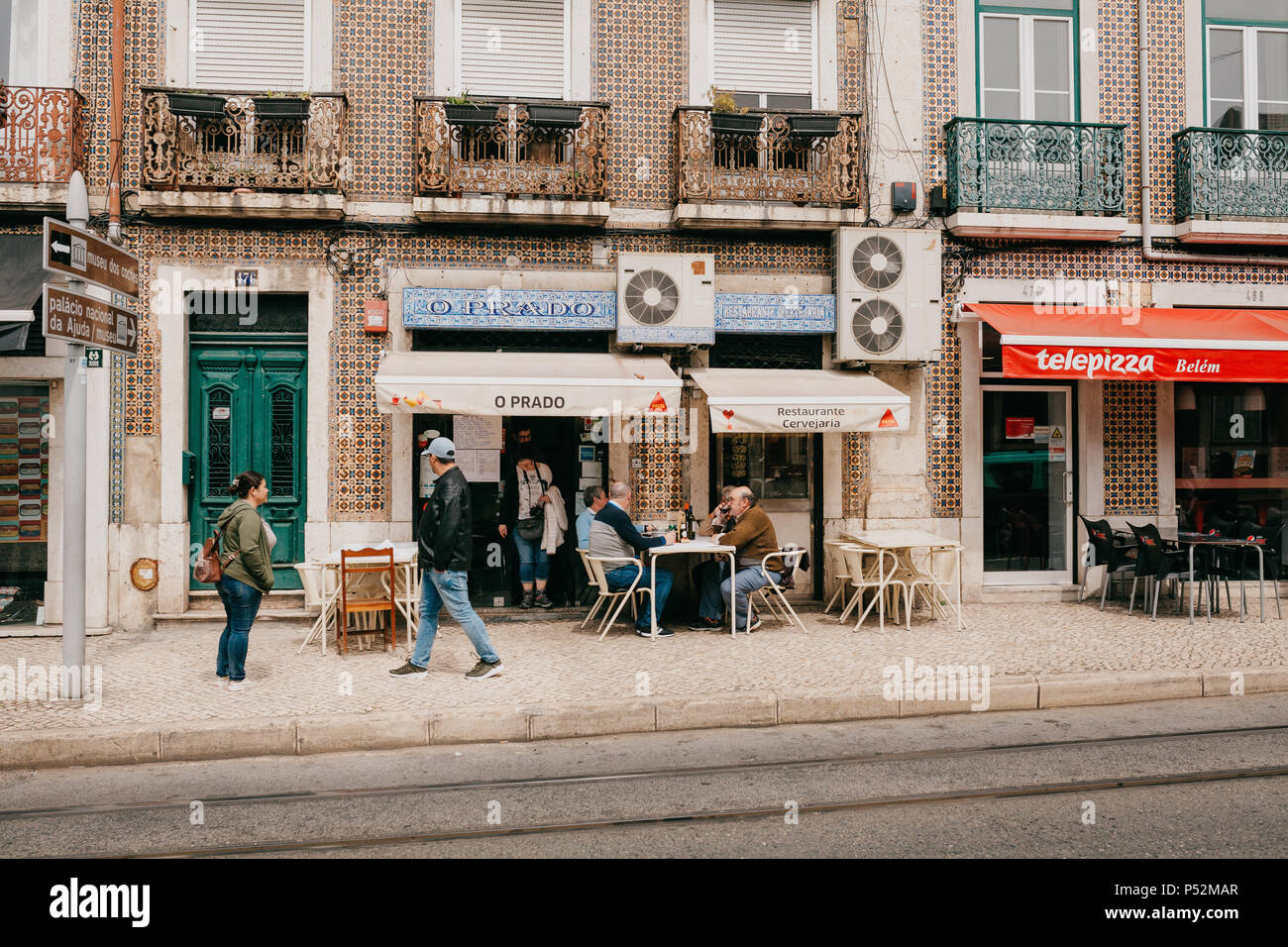 Lisbon, June 18, 2018: A group of men or friends are sitting in the ...