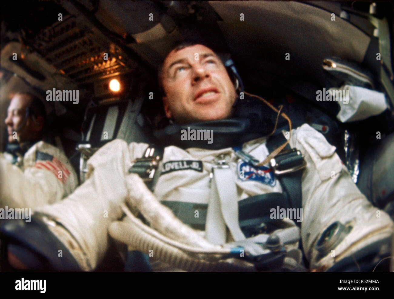 Astronaut James A. Lovell is photographed inside his Gemini spacecraft ...