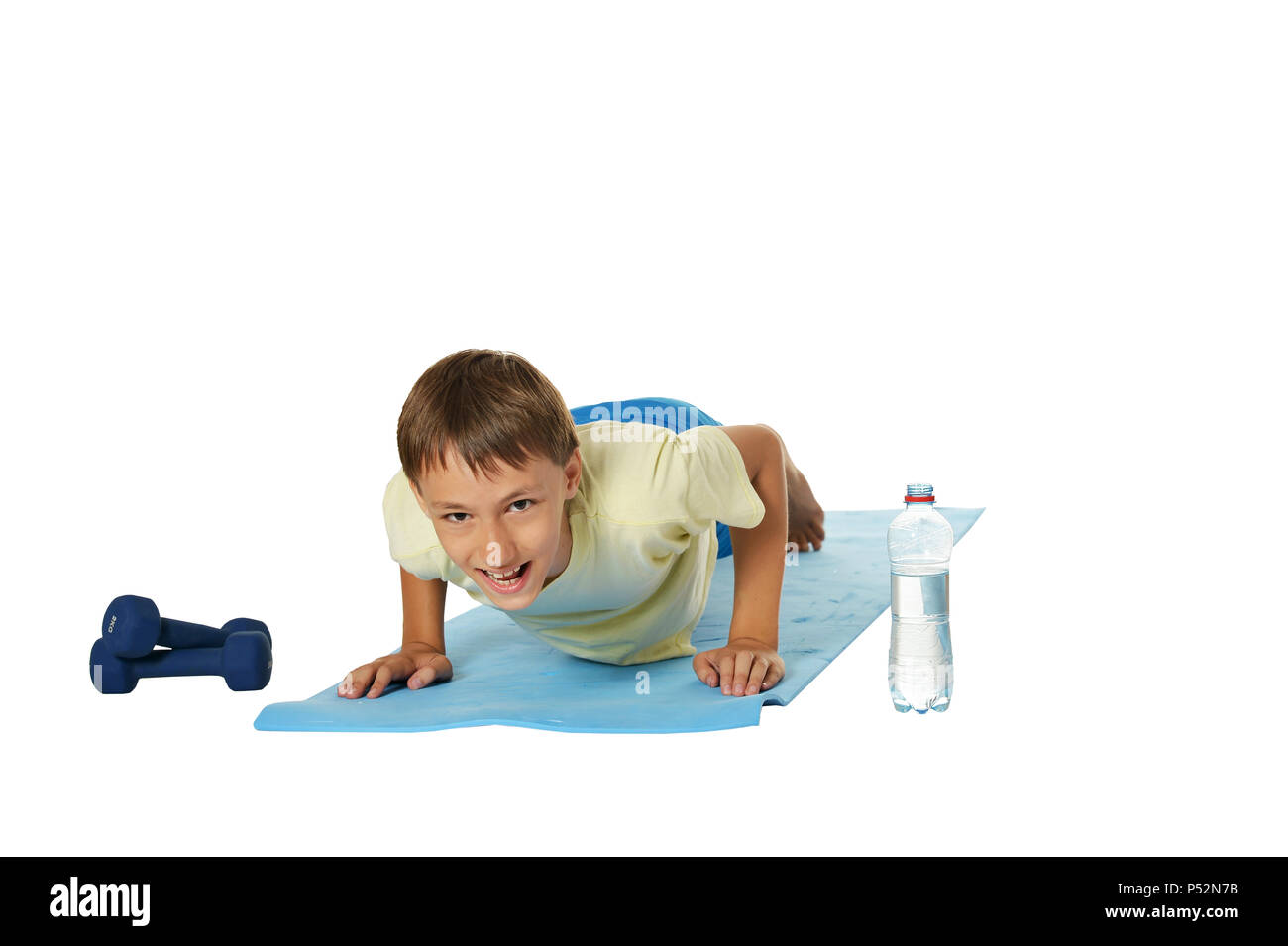 Young boy doing exercises Stock Photo - Alamy