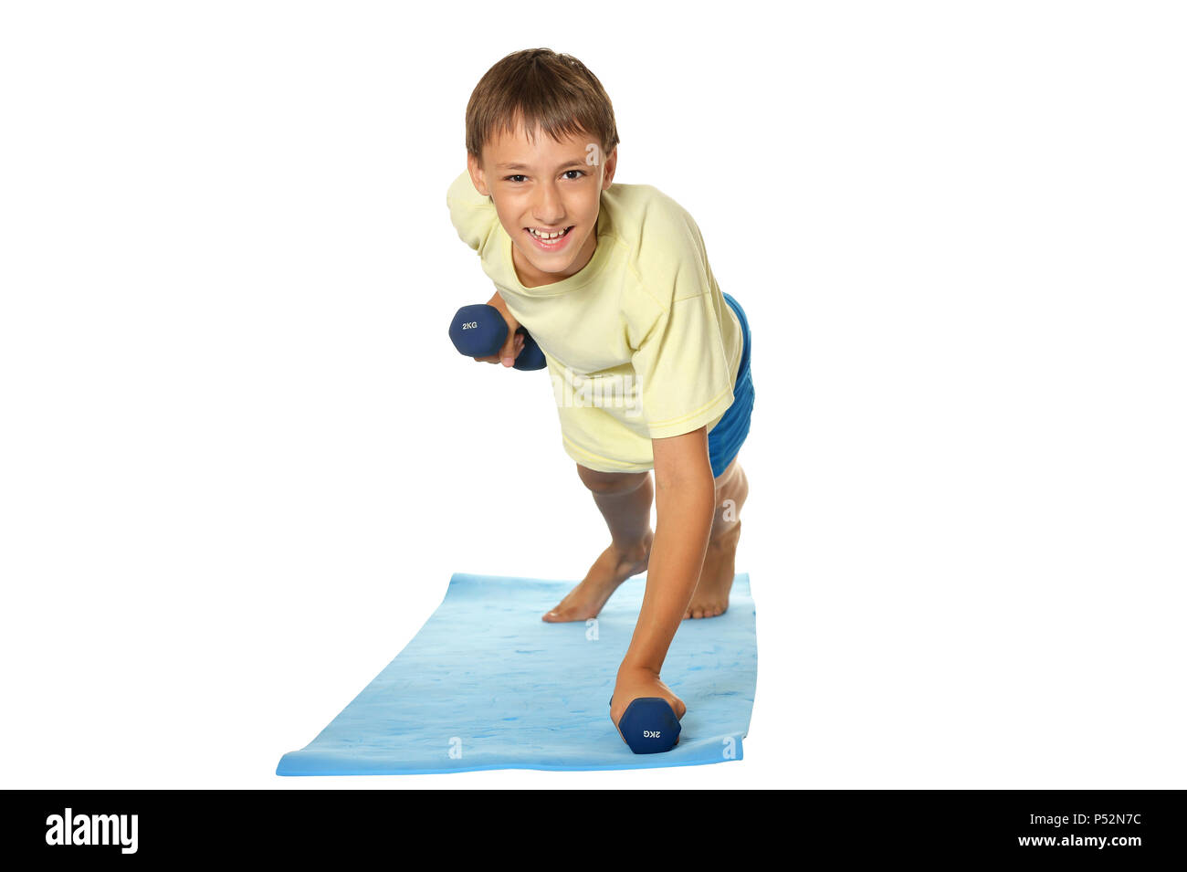 Young boy doing exercises Stock Photo - Alamy