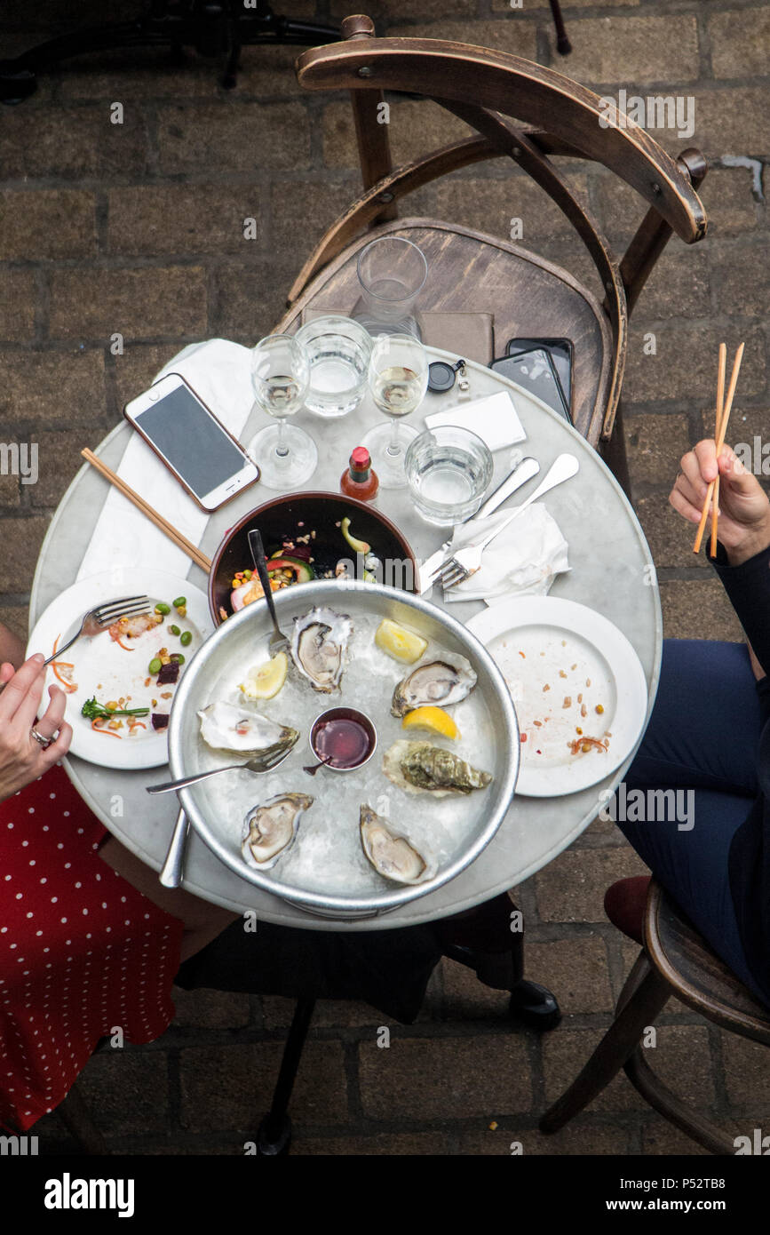 A couple enjoy lunch in a restaurant, taken from above Stock Photo - Alamy