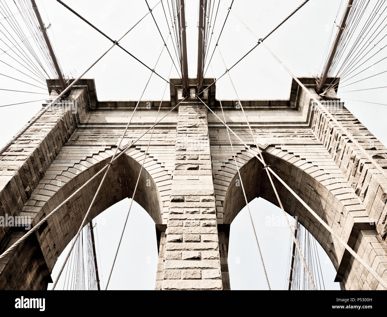 Worms eye view of the two arches on the Brooklyn Bridge. Manhattan, NYC ...