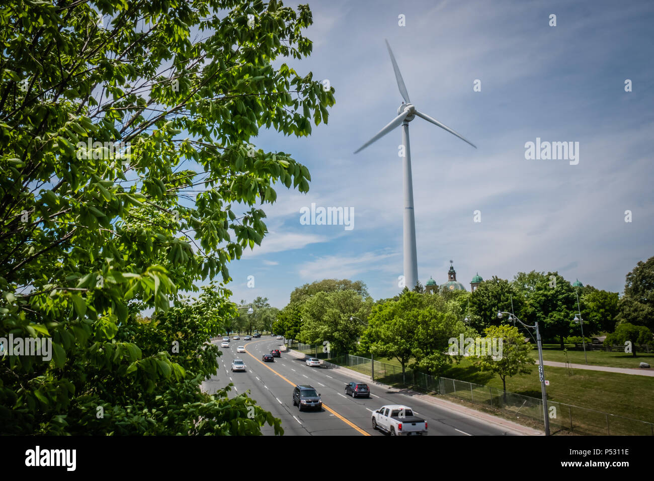 wind turbine built next to road in toronto canada Stock Photo - Alamy