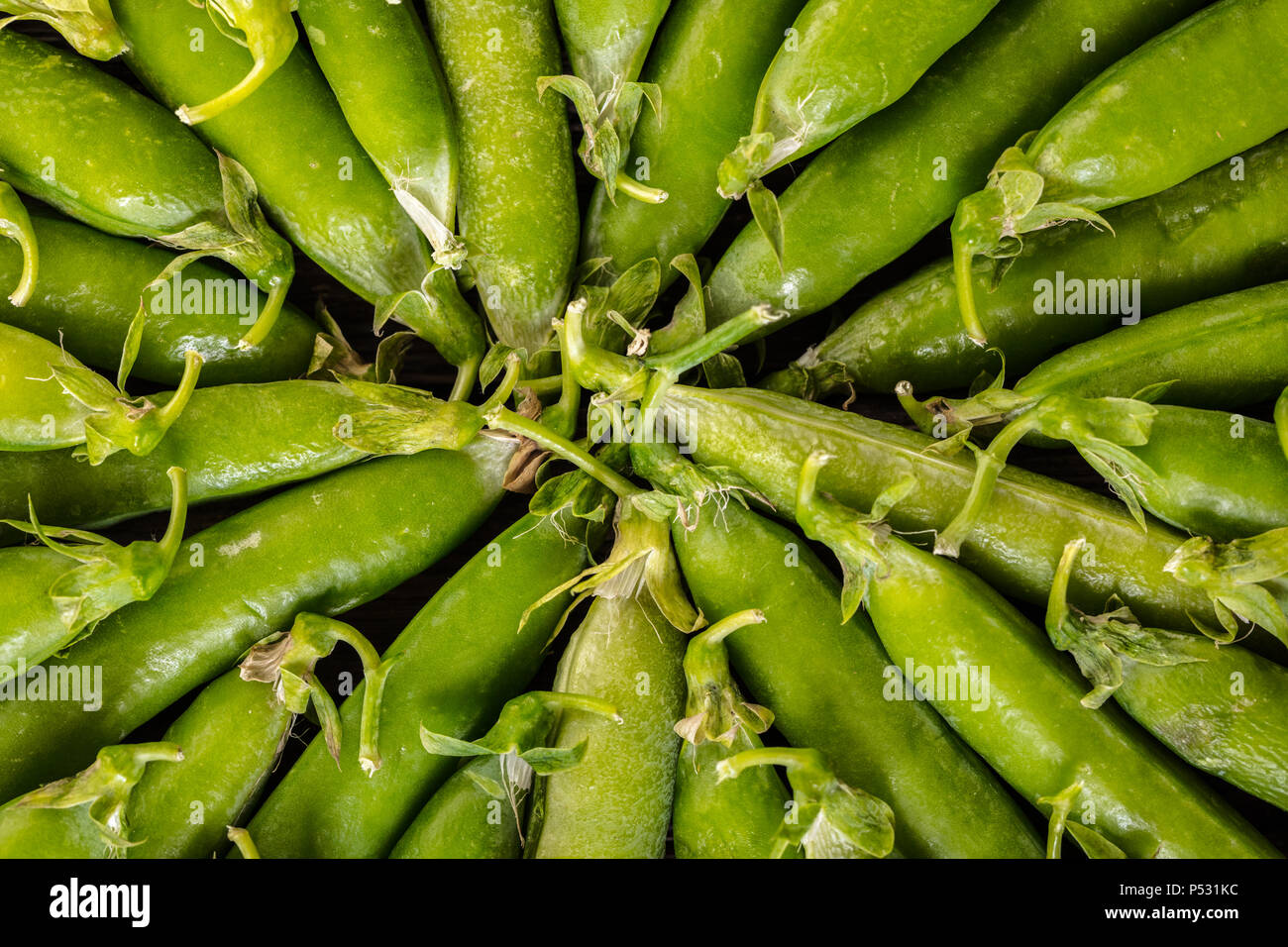 food background of a texture of green peas pods Stock Photo - Alamy