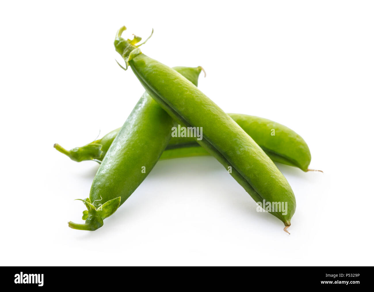 green peas pods isolated on a white background Stock Photo - Alamy