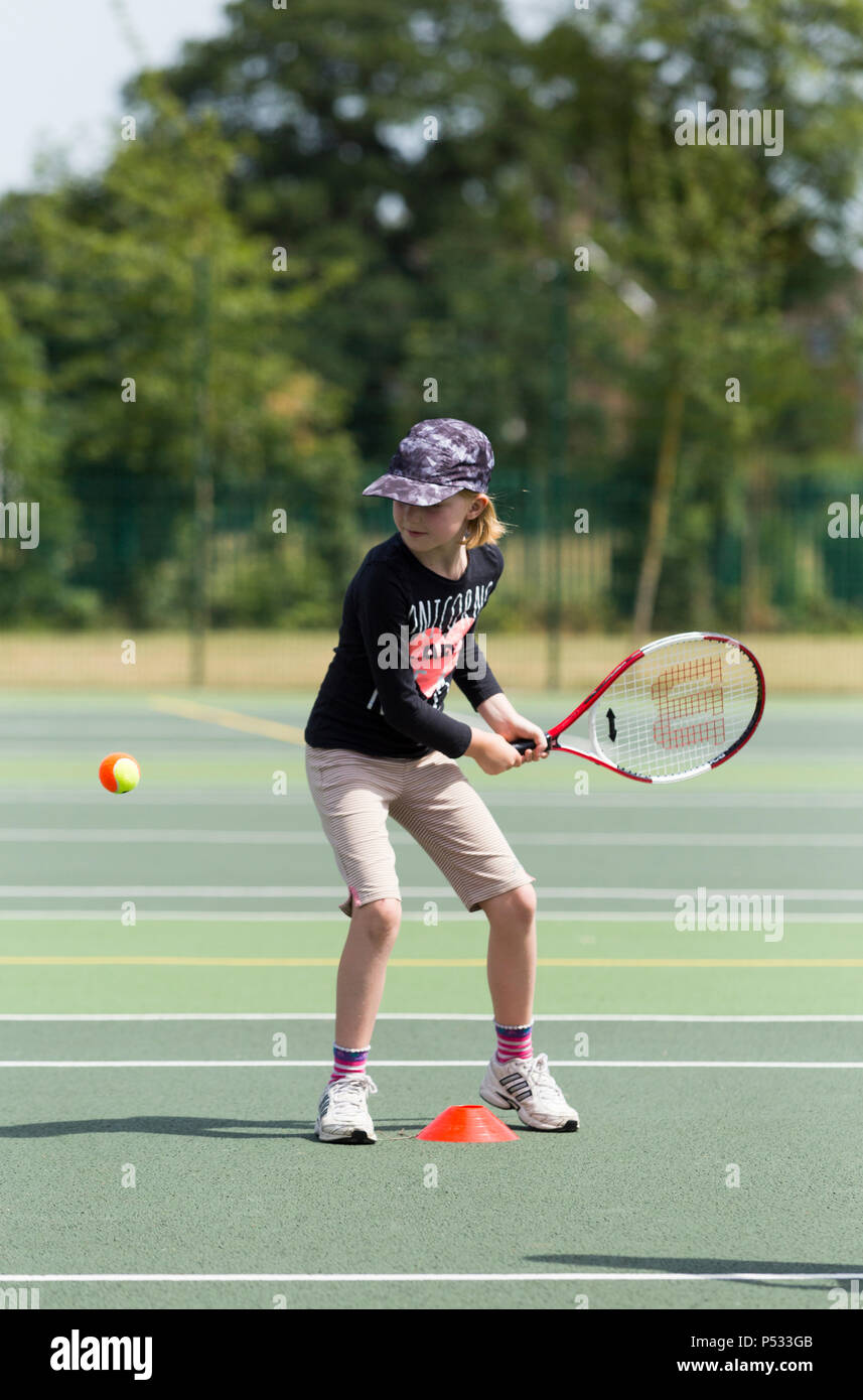 Children's tennis coaching session / lesson taking place on a full-size ...