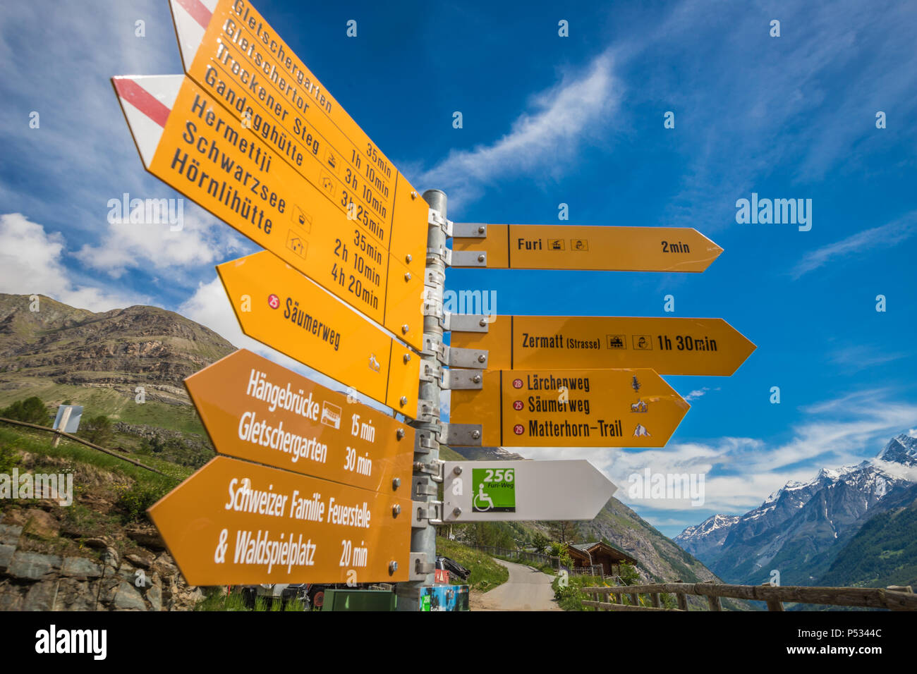 Trail signs in Zermatt Stock Photo - Alamy