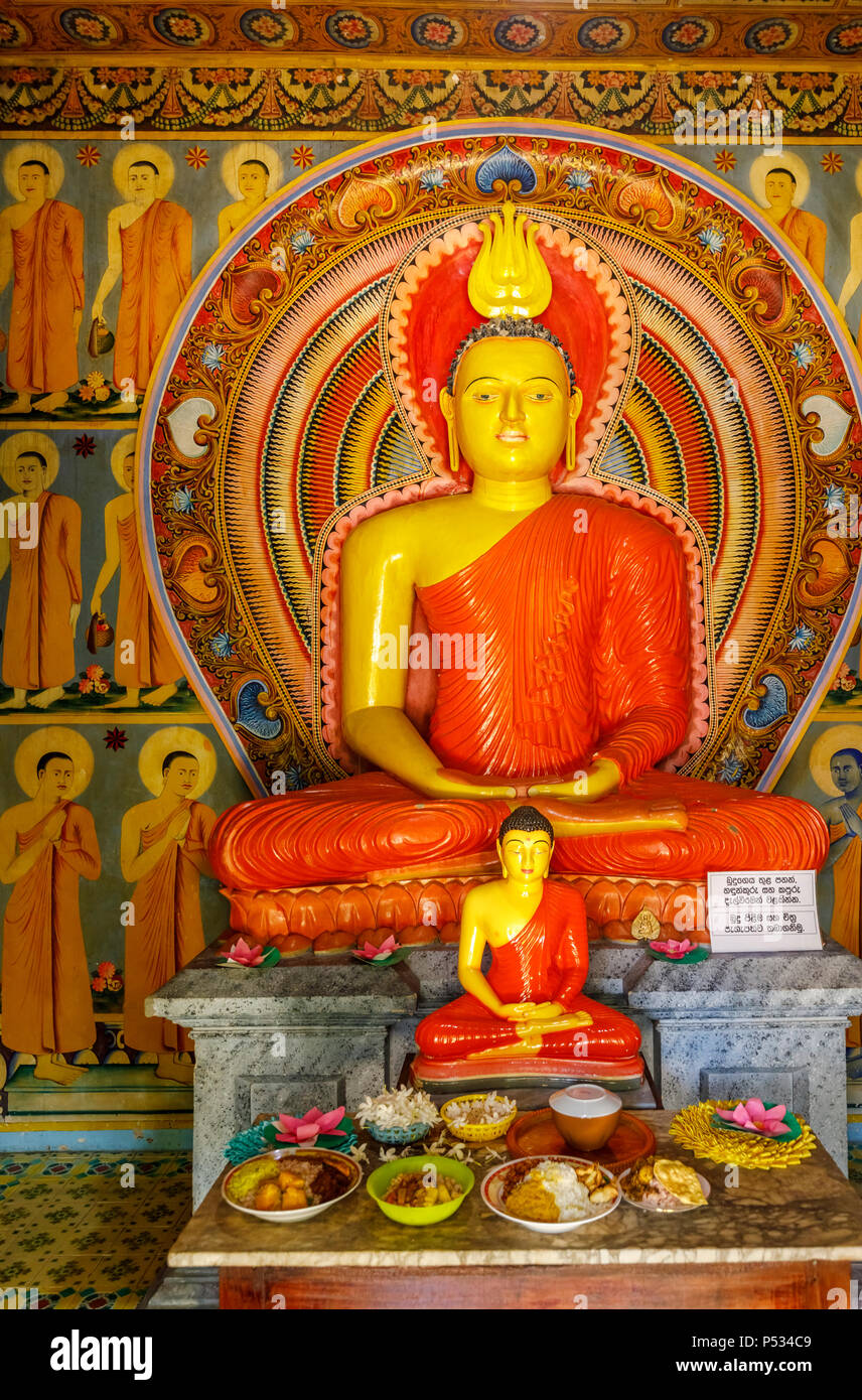 Buddha statues in a shrine inside Sri Wickramasinghe ancient temple ...