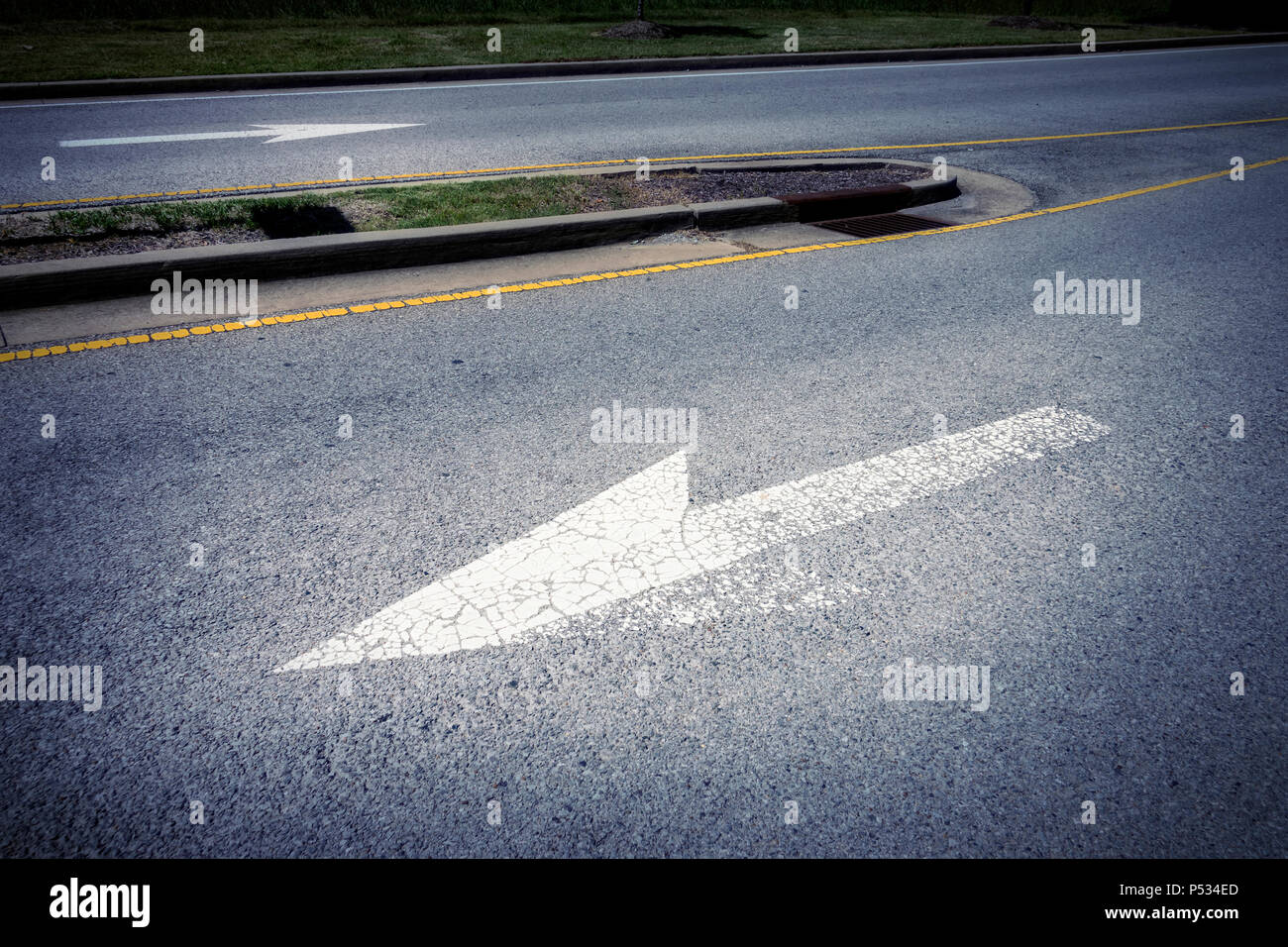 an image of an arrow sign on the road Stock Photo - Alamy