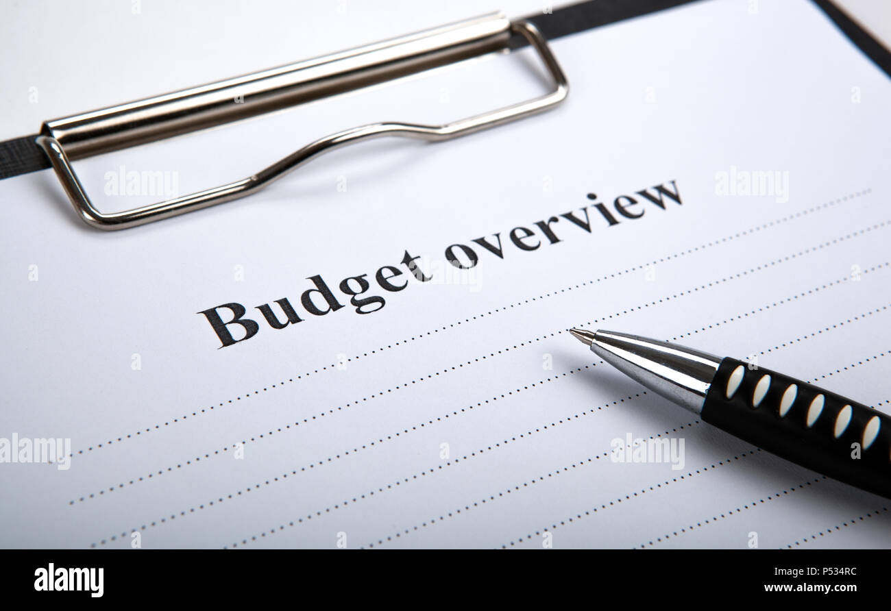 document with title budget overview and pen close up Stock Photo - Alamy