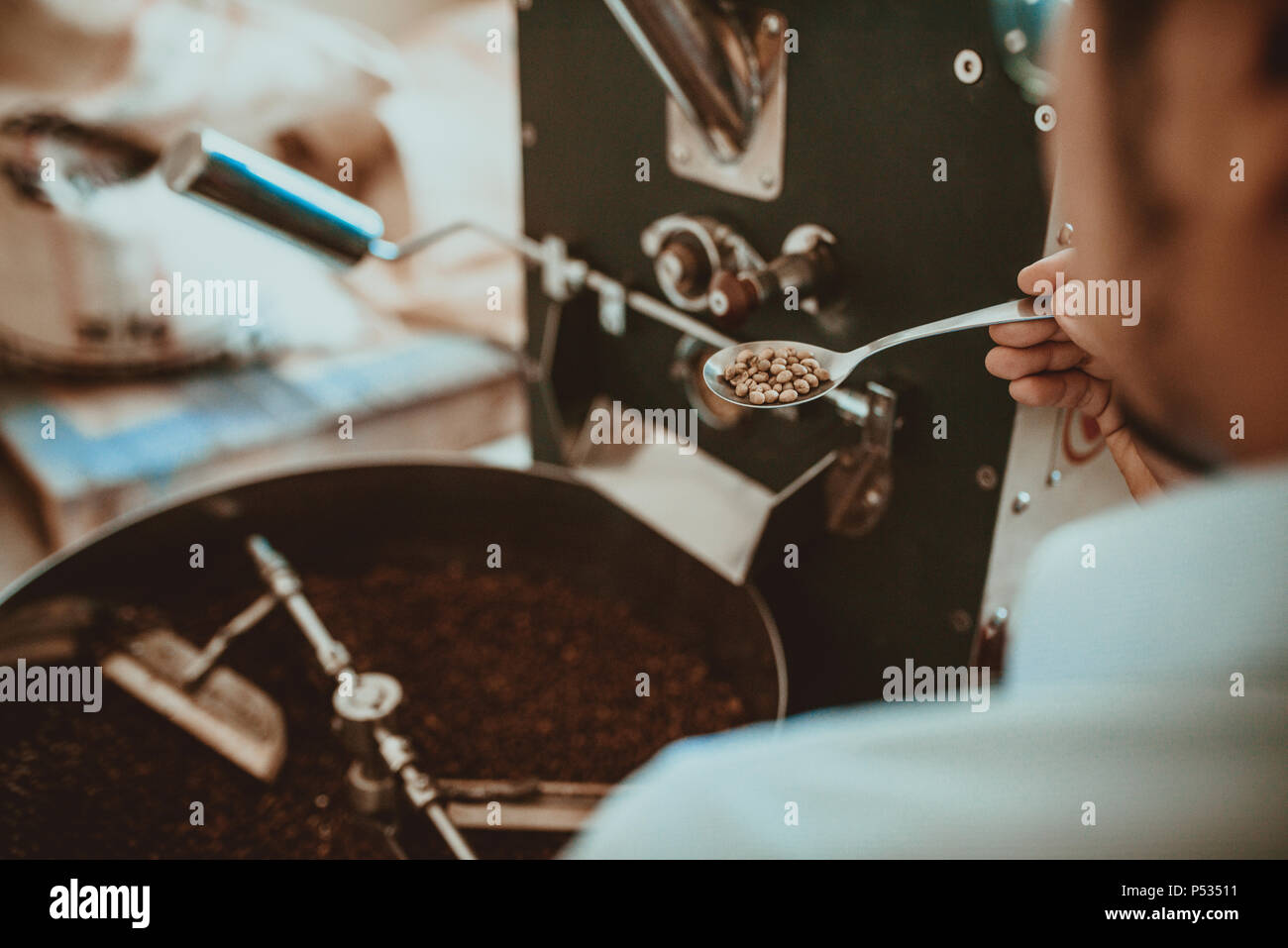 Professional coffee roasting and testing with hand in Colombia Stock ...