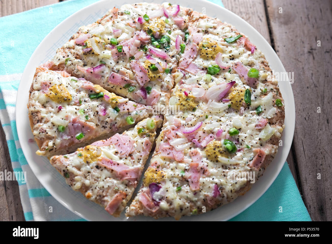 French creme from age pizza with red onion, ham, mustard honey sauce ...