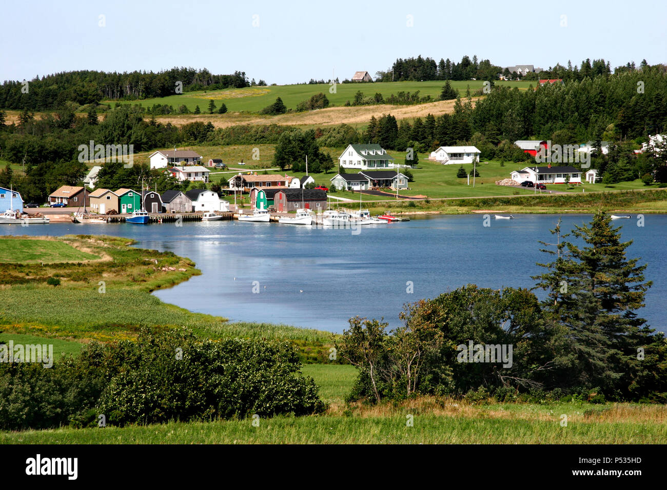 Boats and houses along the water in a quaint Canadian town Stock Photo ...