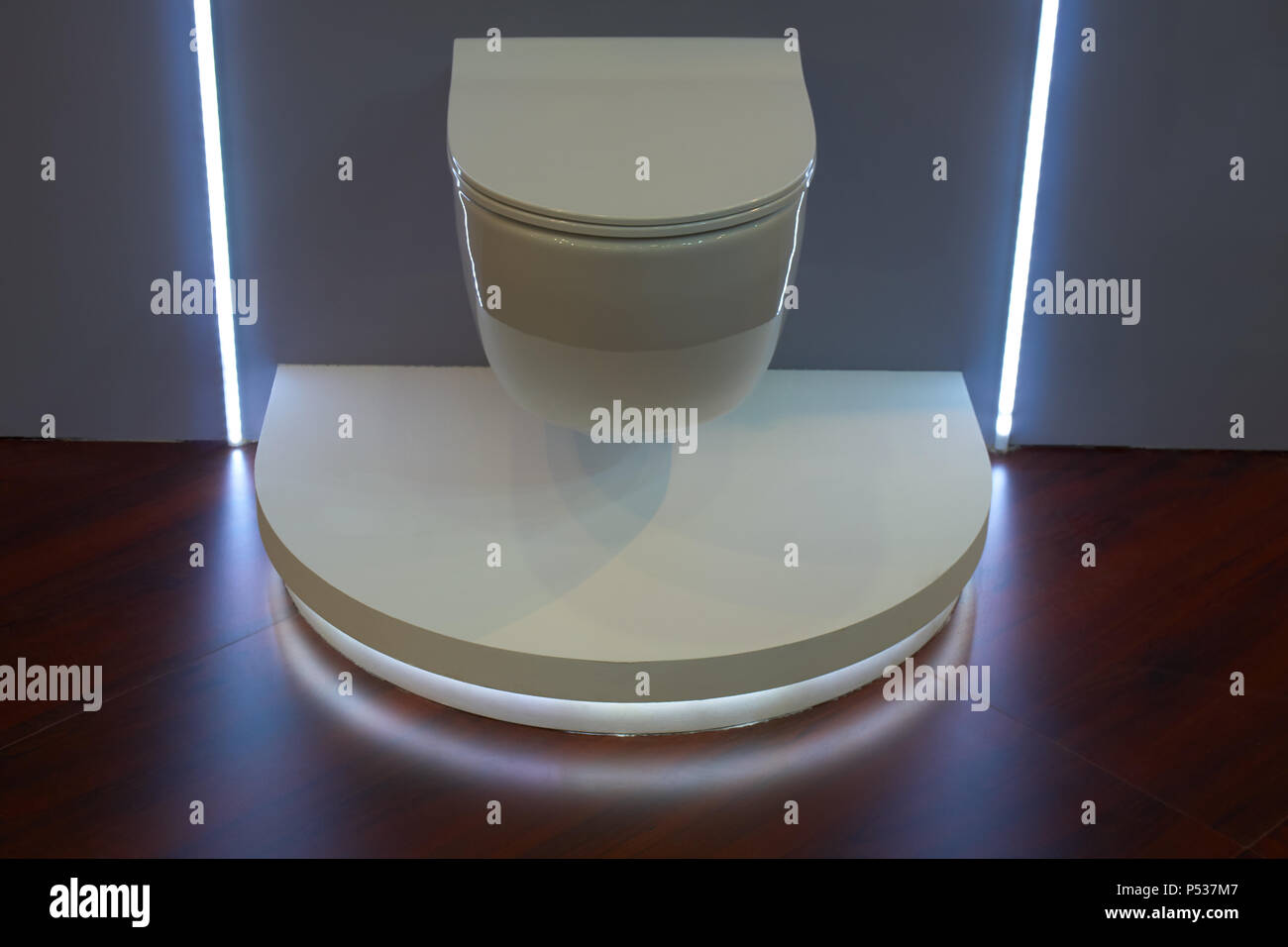 White modern led lit toilet in restroom Stock Photo - Alamy