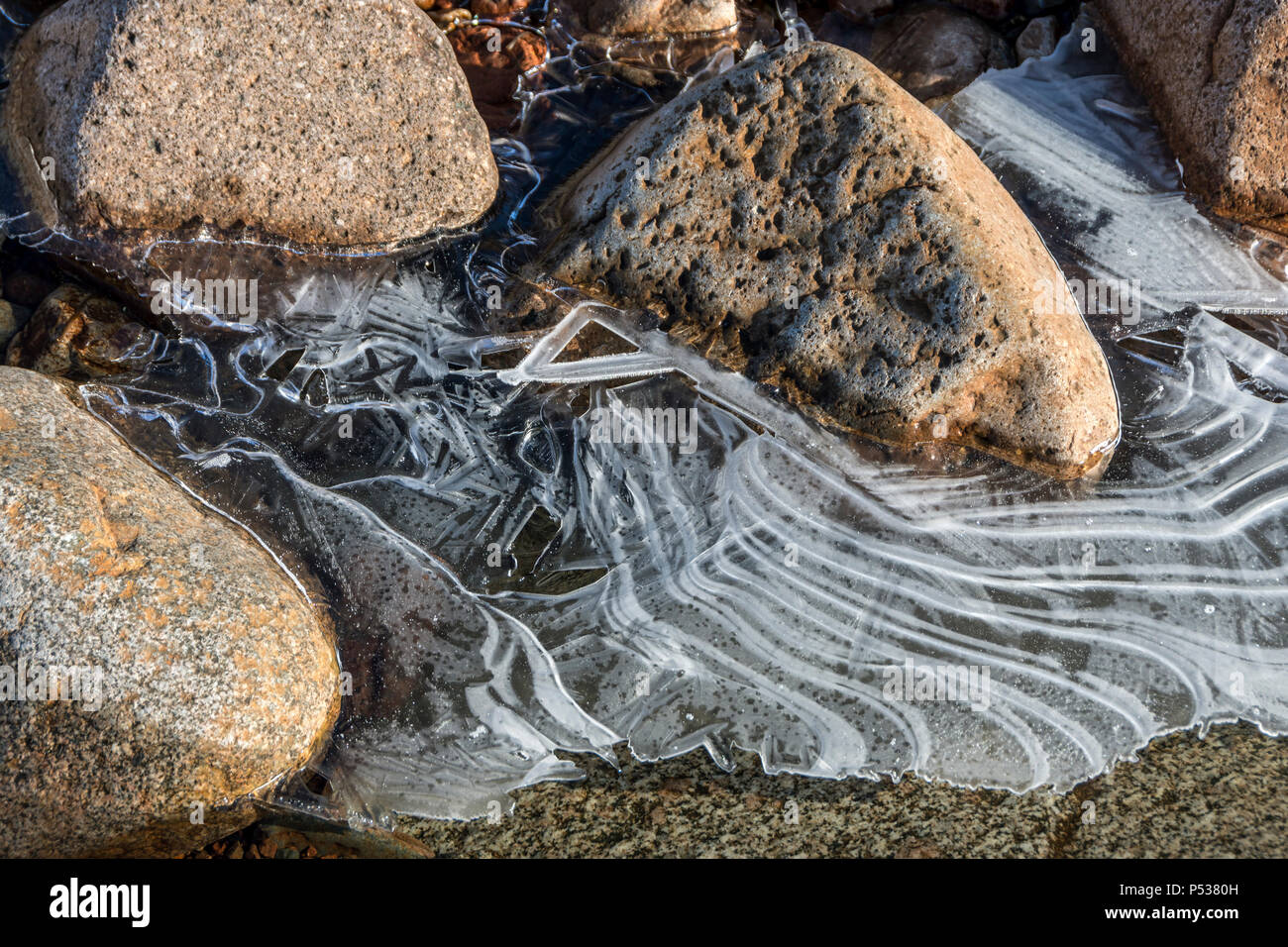 Ice patterns and rocks by the river Coupall, Rannoch Moor, Highland ...